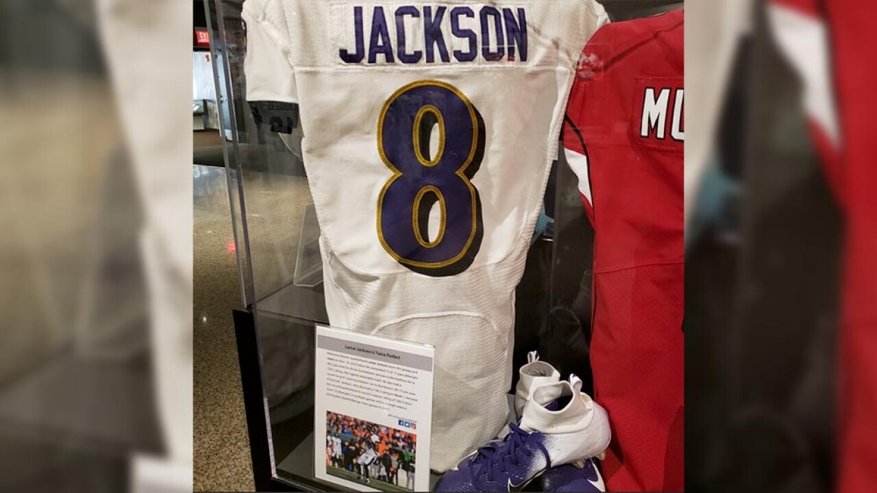Lamar Jackson's cleats and jersey are now displayed at the Pro Football ...