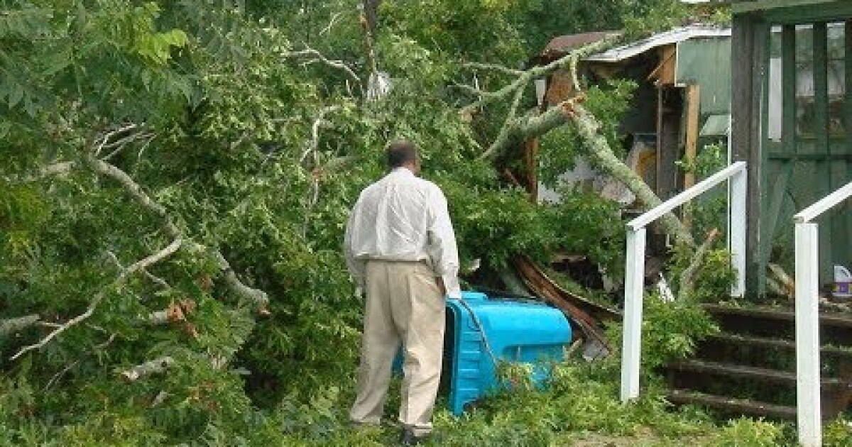 Man escapes injury after tree falls on home