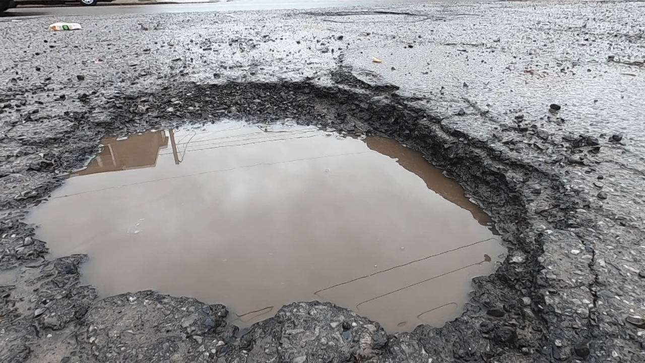 Local radio personality fills Western New York's worst potholes with ...