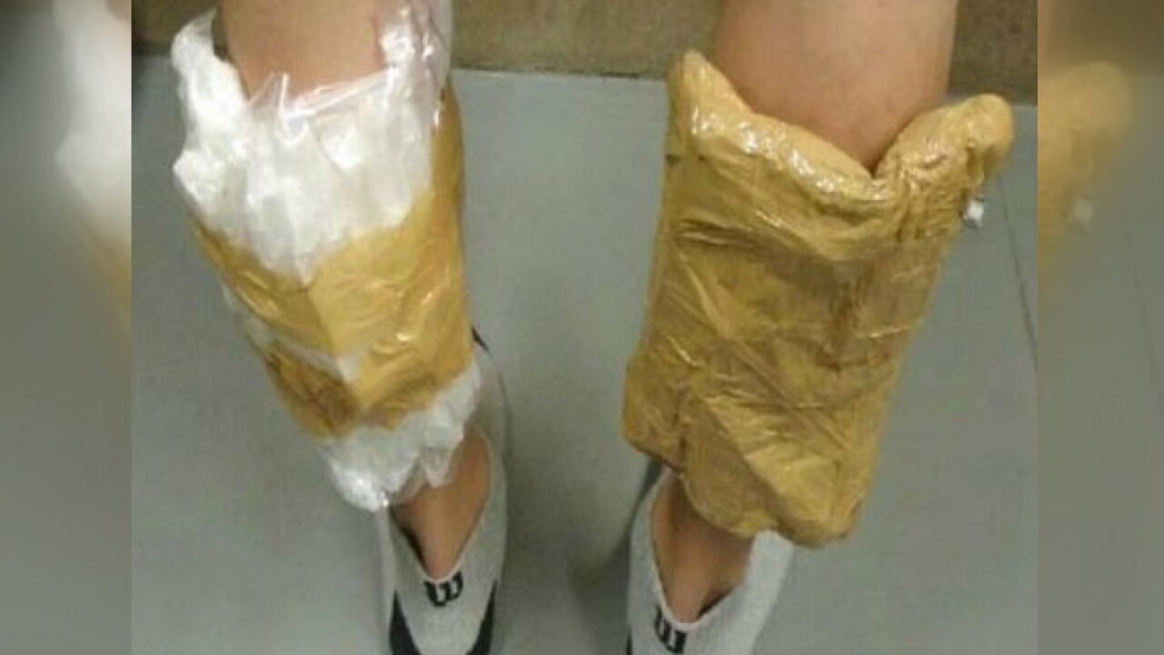 Suspected drug smuggler caught with meth taped to legs, belly
