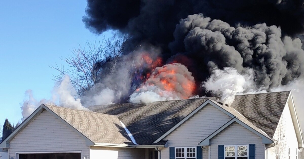 Two residents escape fire believed to be caused by fireplace ashes
