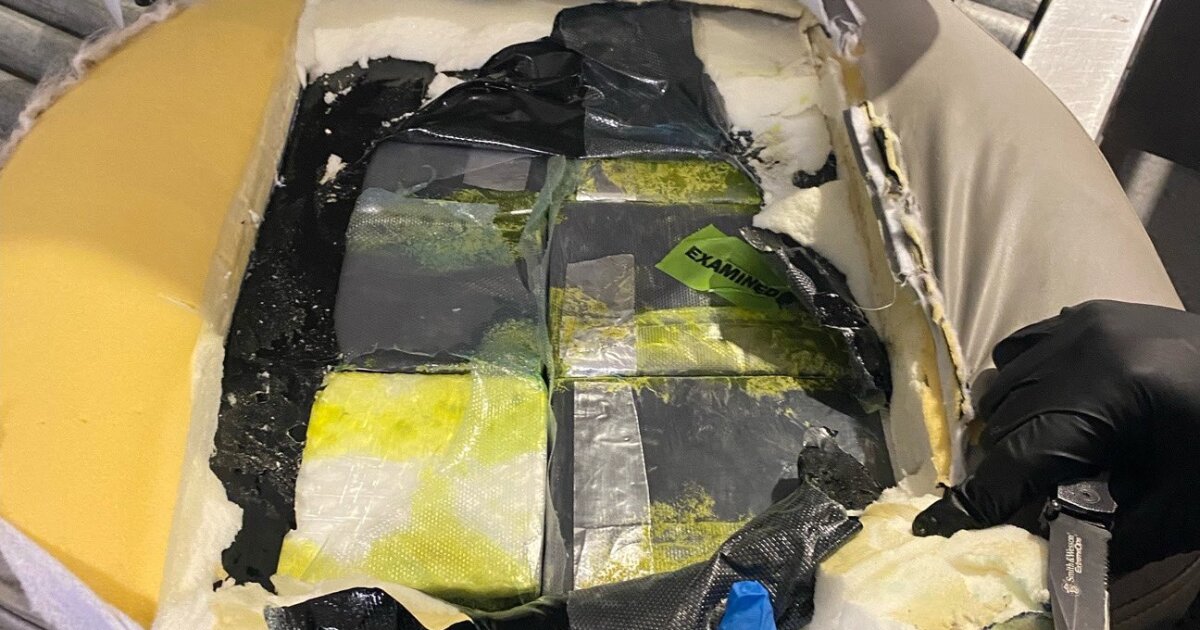Man arrested at US airport after bricks of cocaine found hidden in ...