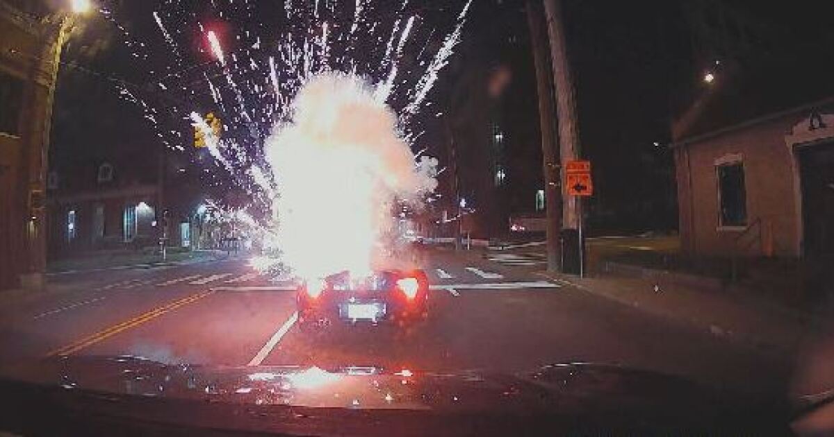 Lit firework thrown into man's convertible caught on video