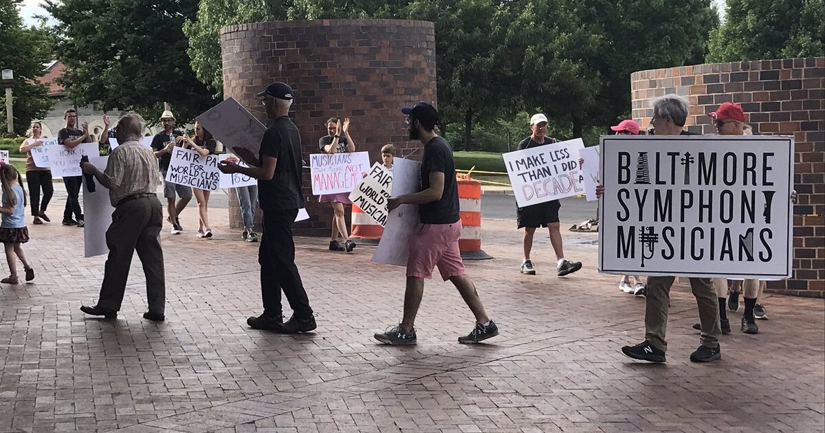 BSO Musicians trade instruments for signs amid lockout
