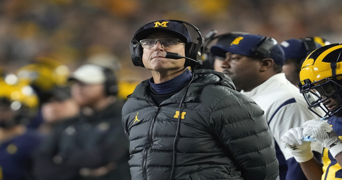 Jim Harbaugh not on sidelines at Michigan-Penn State game