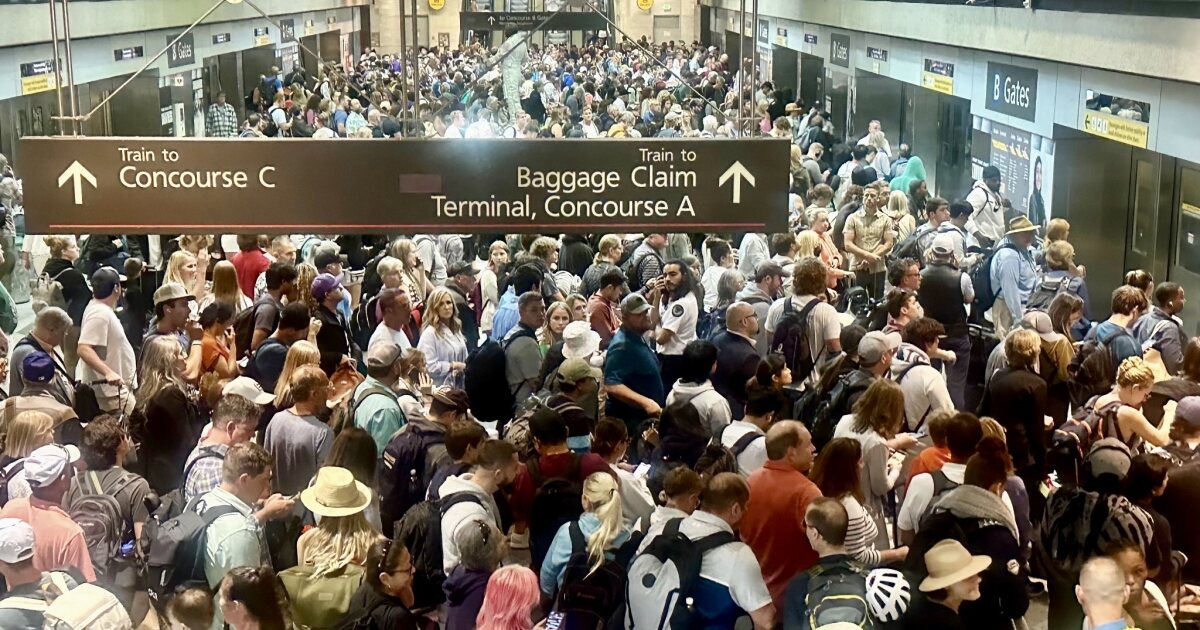 DIA train platform packed with passengers during delay Wednesday