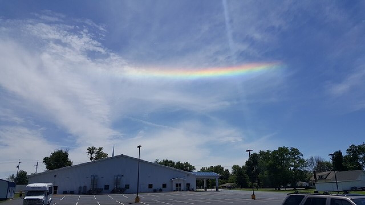 Rare circumhorizontal arc forms upside-down rainbows below the sun