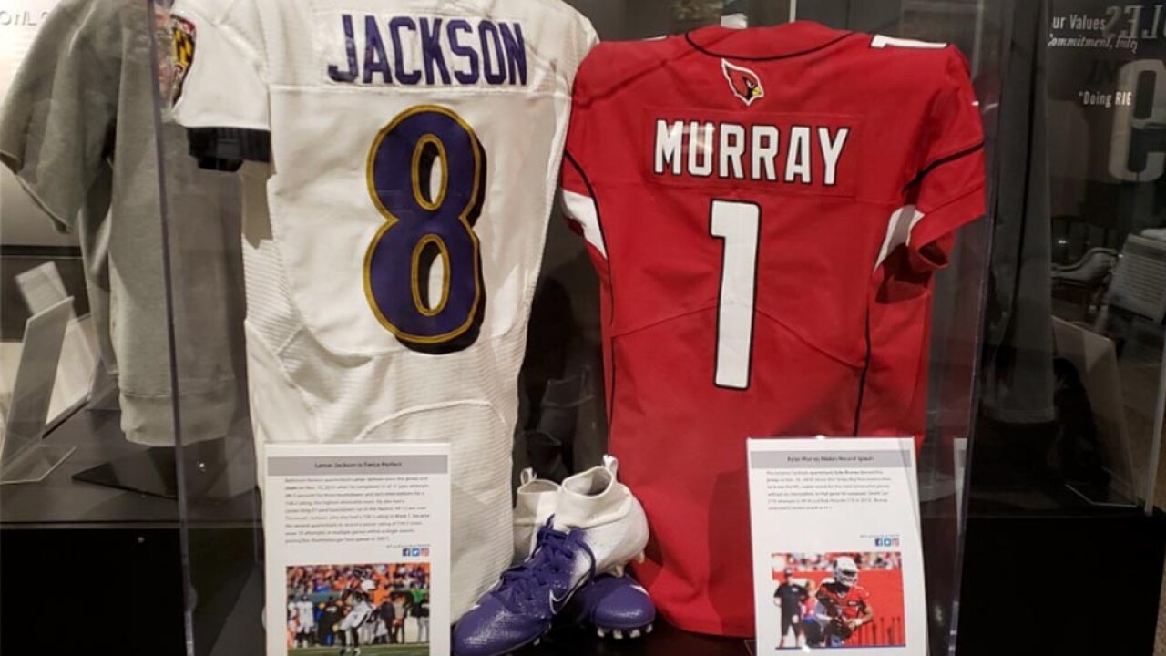 Lamar Jackson's cleats and jersey are now displayed at the Pro Football ...